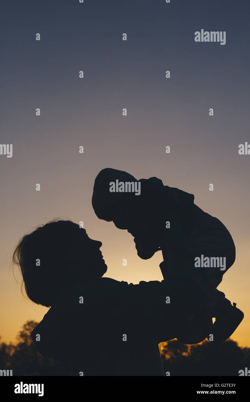 mom with child at sunset Stock Photo - Alamy