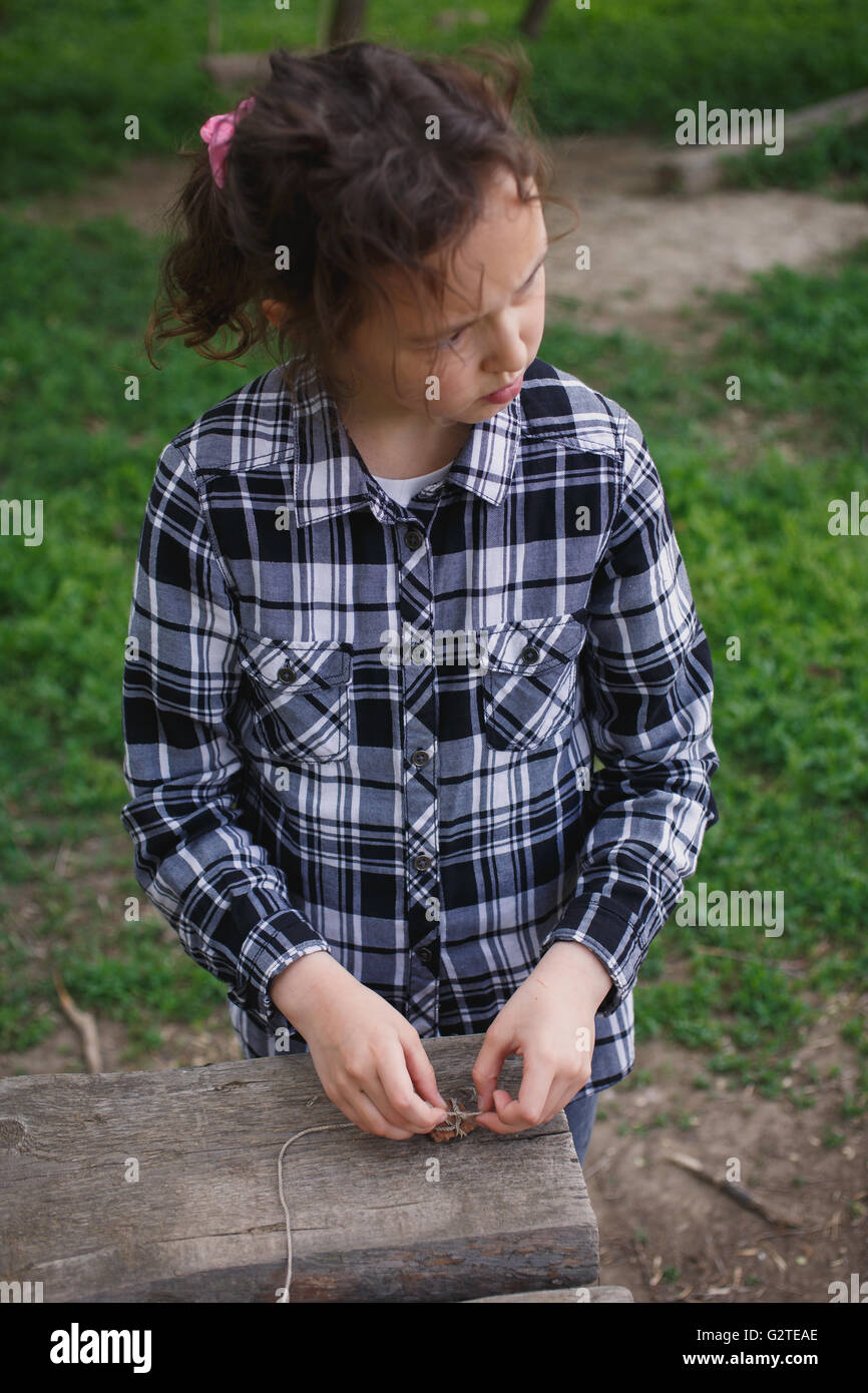 girl playing alone in the street Stock Photo - Alamy