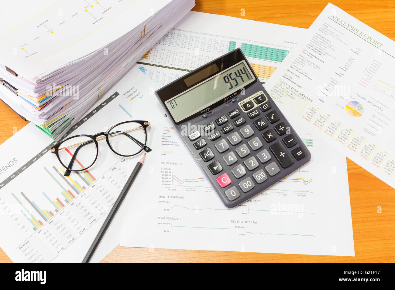 Business concept of a pencil, charts, eyeglasses, calculator Stock ...