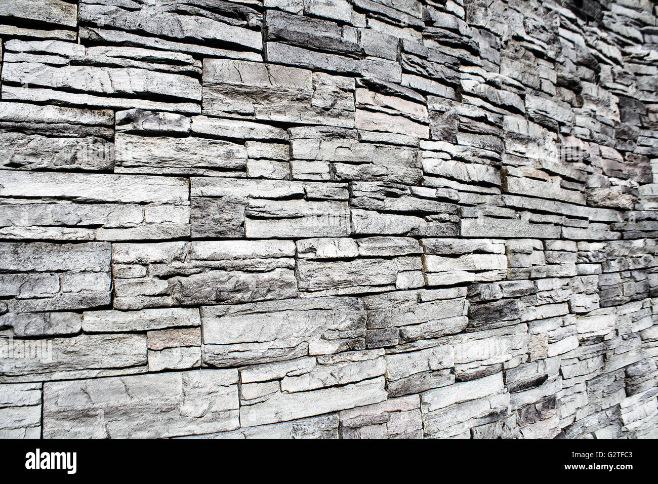 Stone wall texture as background Stock Photo - Alamy