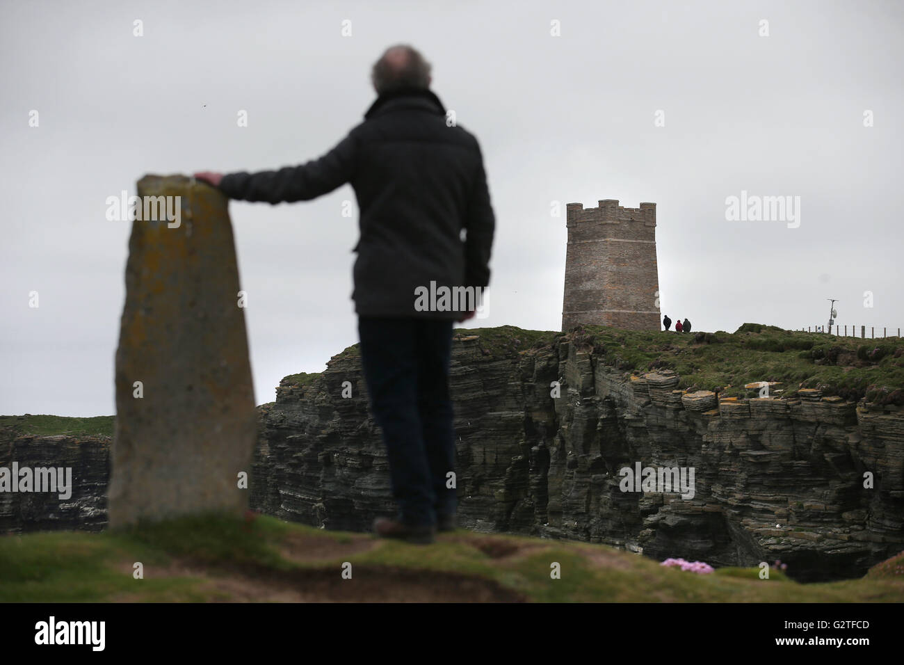 A visitor looks at a tower built to hold the restored Kitchener ...