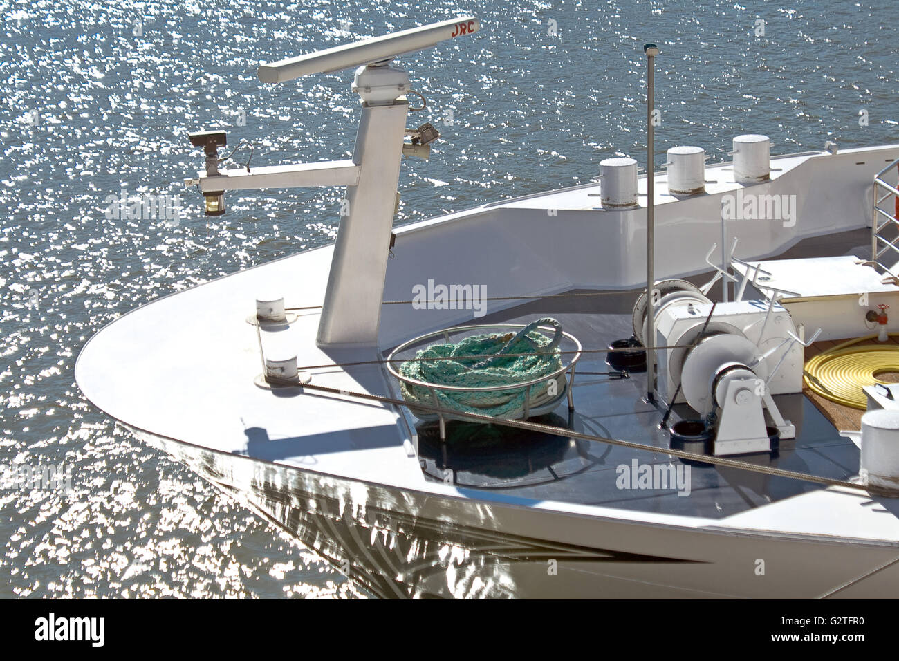 Bow and deck of the ship beside glistening water Stock Photo - Alamy