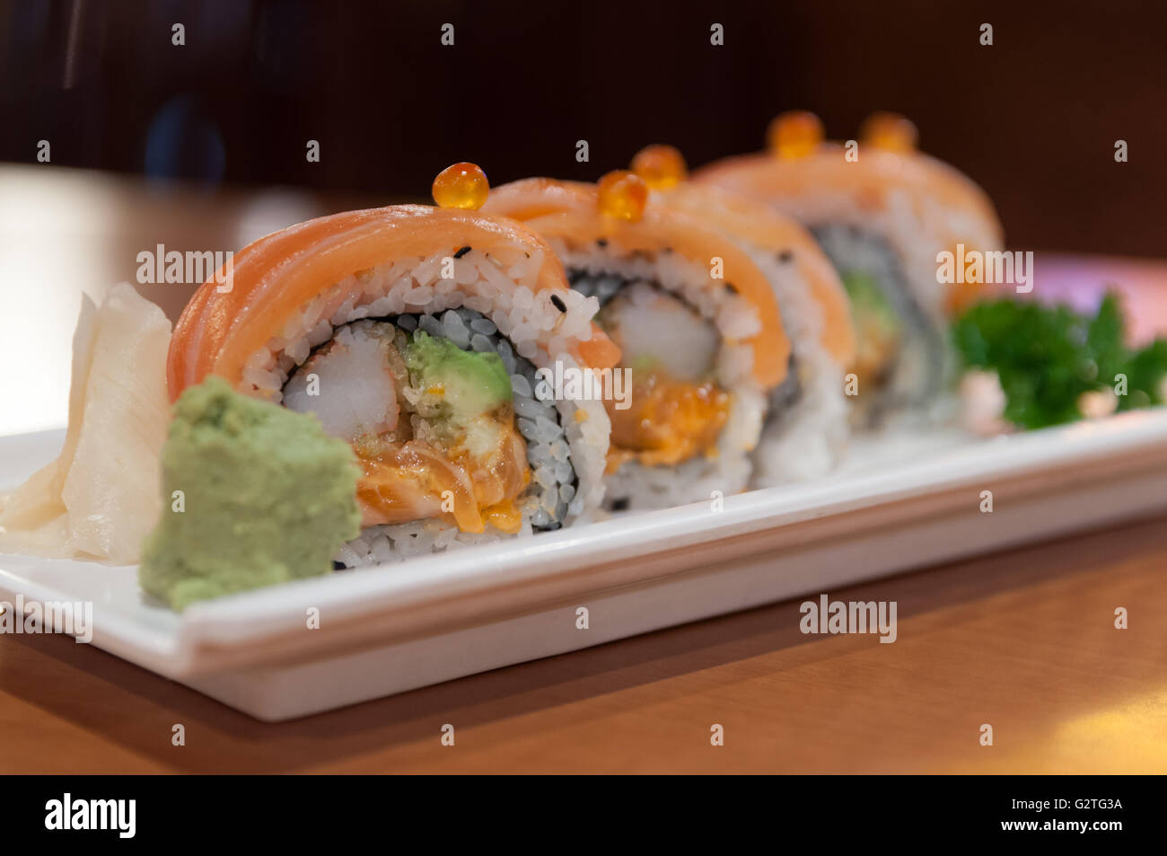 Freshly prepared sushi roll at an authentic Japanese restaurant with ...