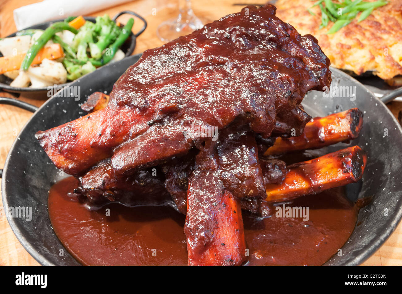 Mouth watering racks of beef ribs, served with all the fixings ...