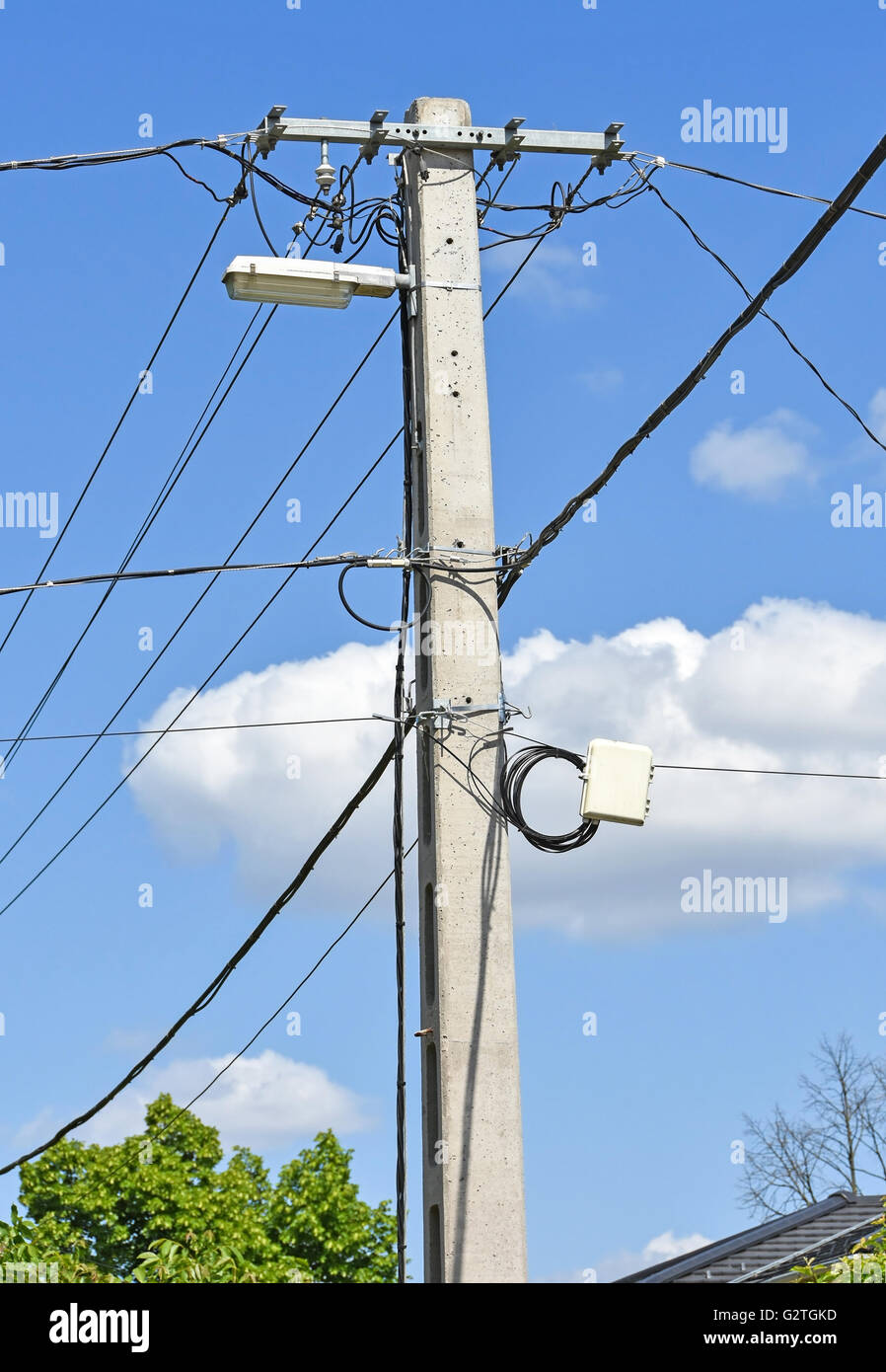 Electricity pylon with street light Stock Photo - Alamy