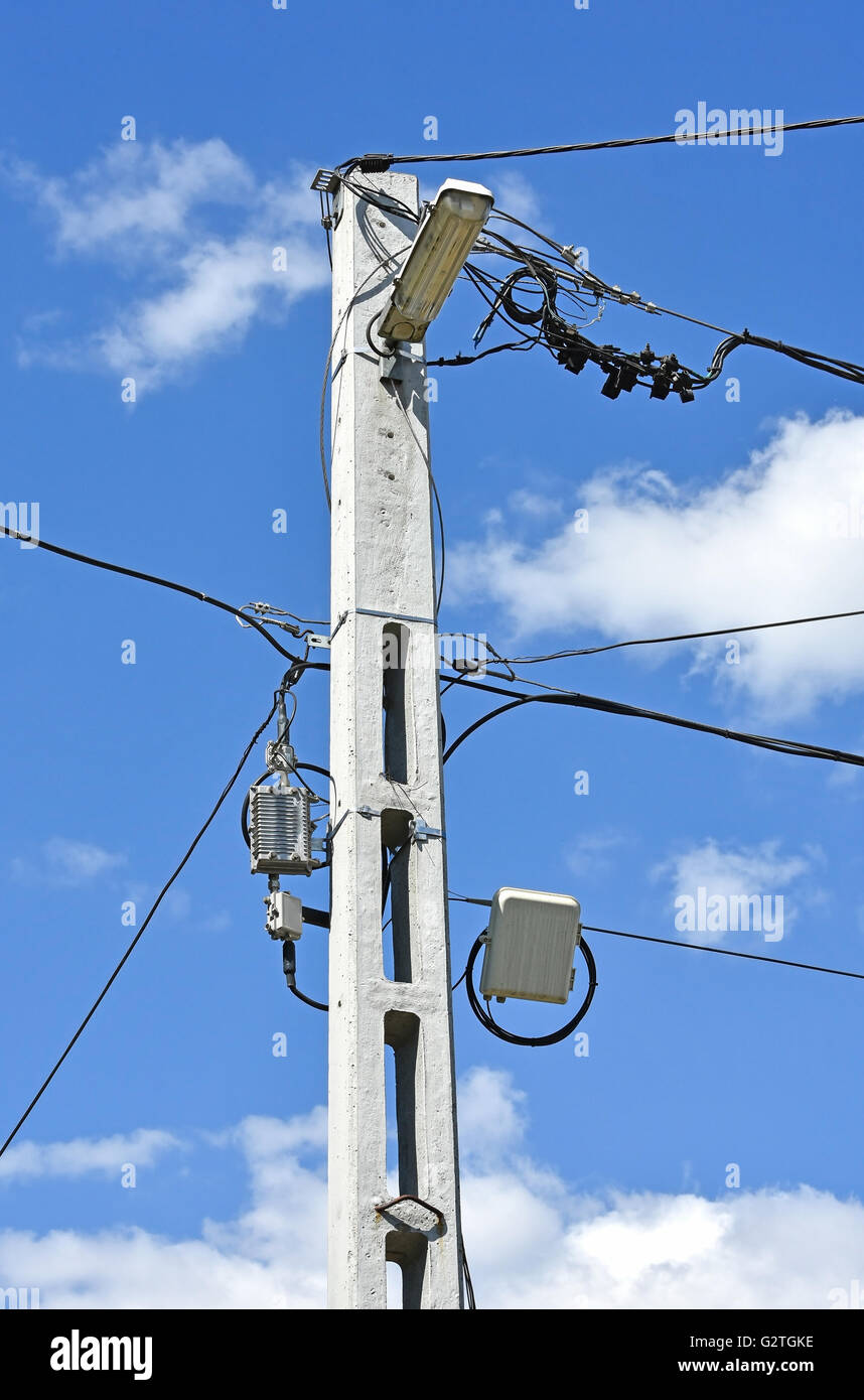 Electricity pylon with street light Stock Photo - Alamy
