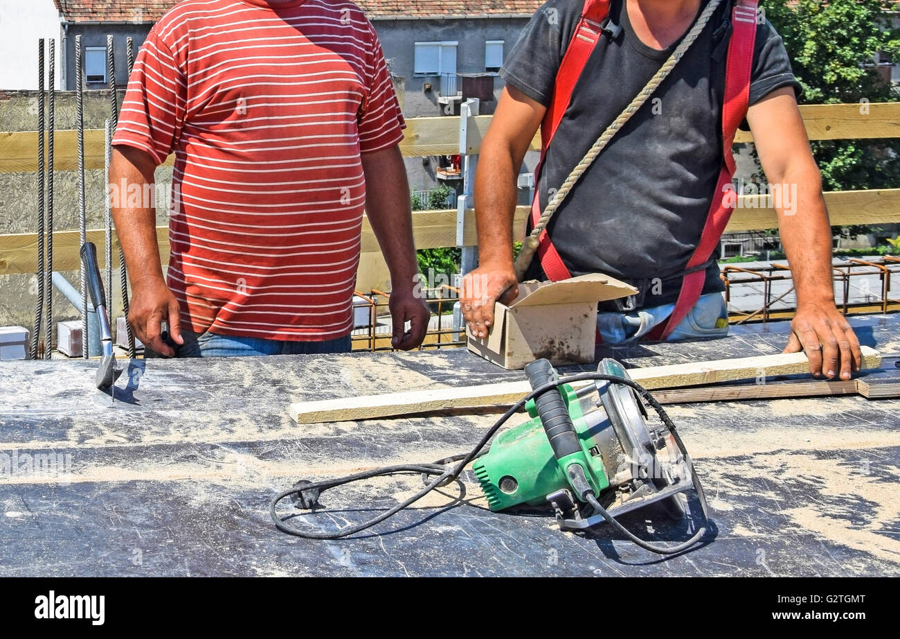 Construction workers at work outdoors Stock Photo - Alamy