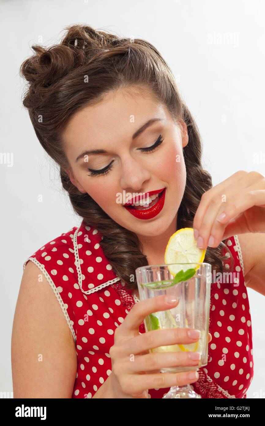 A retro-stlye girl drinking lemonade Stock Photo - Alamy
