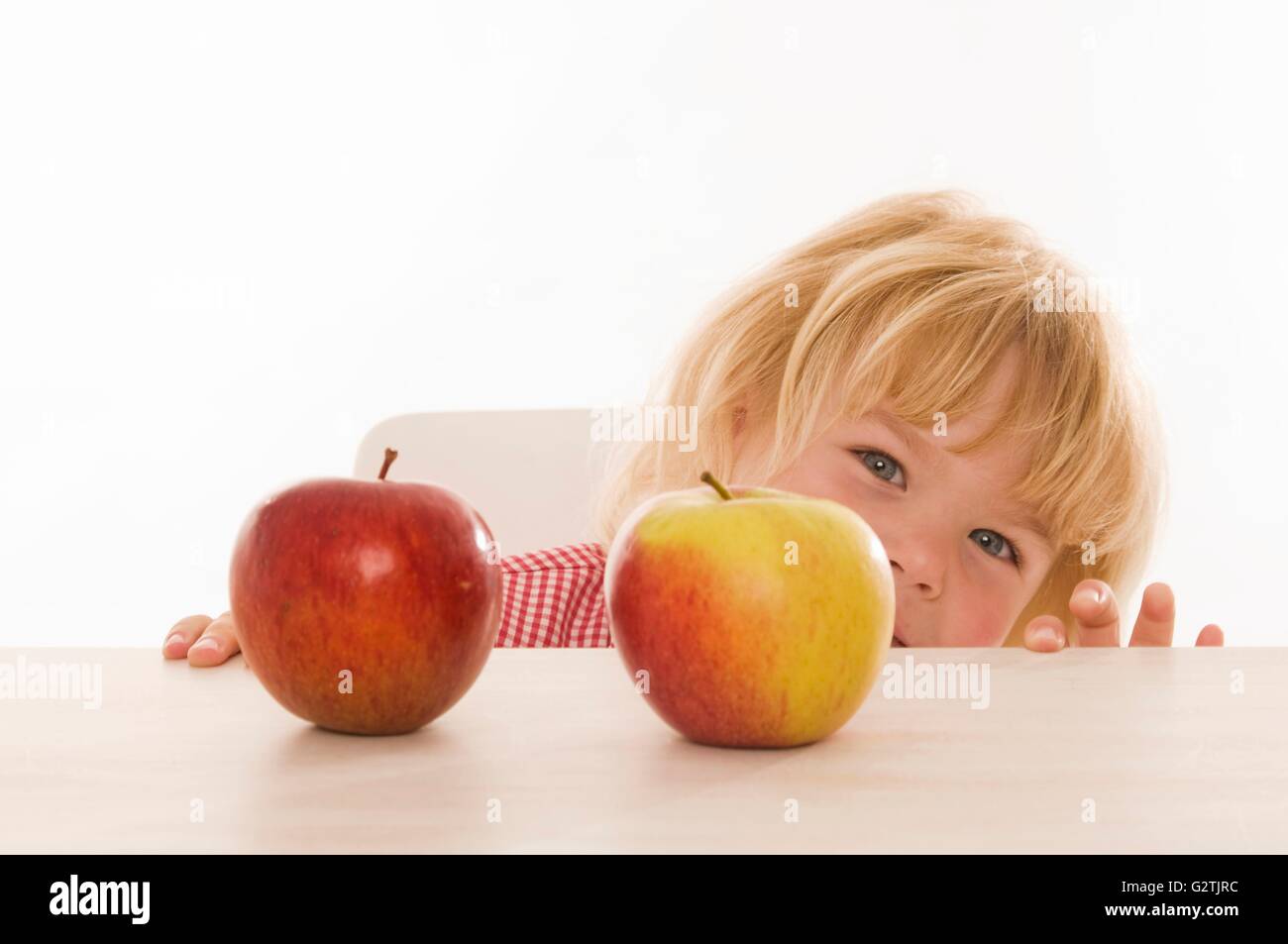 Little girl with two organic apples Stock Photo - Alamy