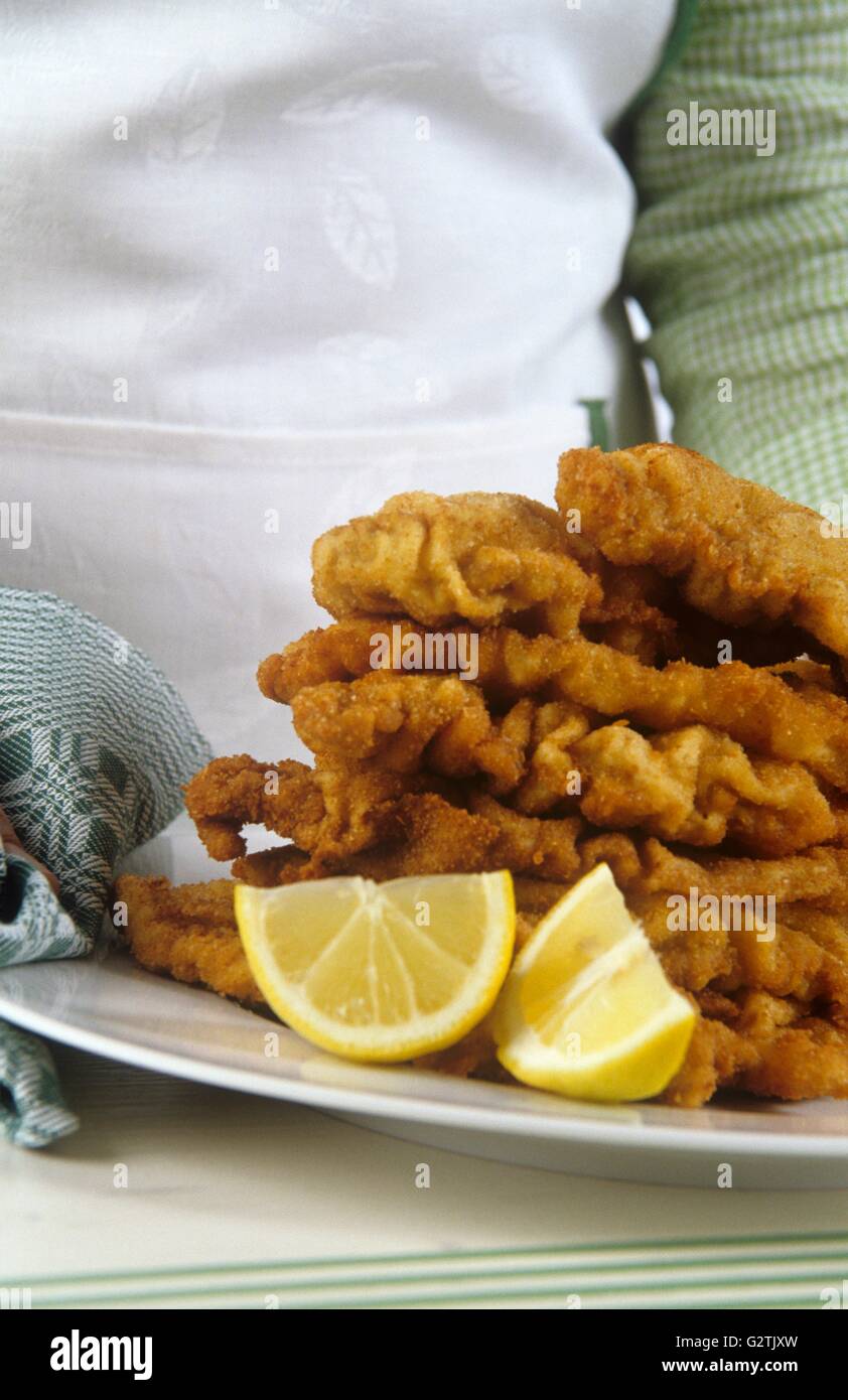 Several Wiener Schnitzel (breaded veal escalopes) on plate Stock Photo ...