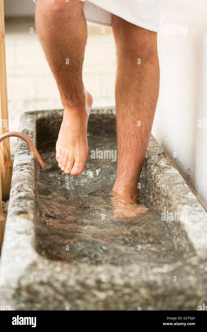 Man walking in wading pool Stock Photo - Alamy