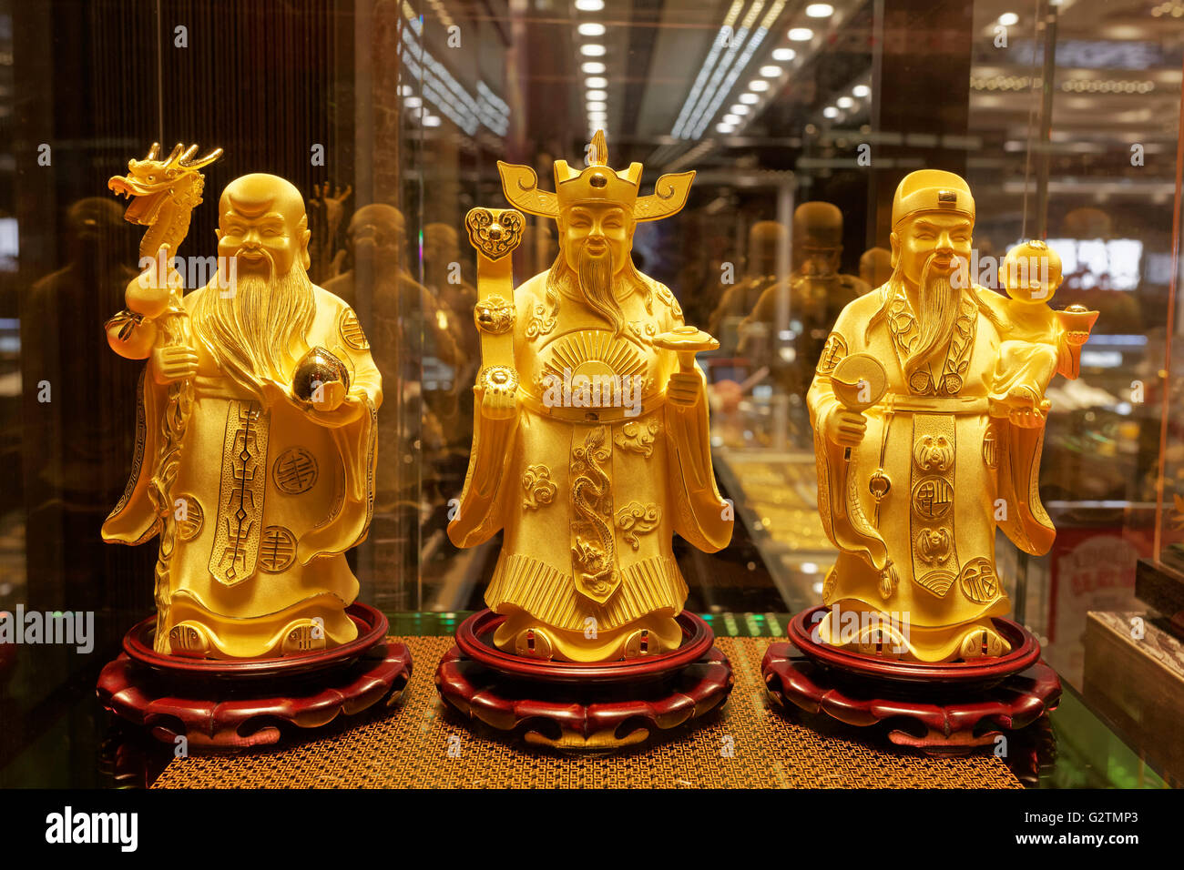 Daoist deities of pure gold in showcase, Chow Tai Fok Jewellery, Nathan ...