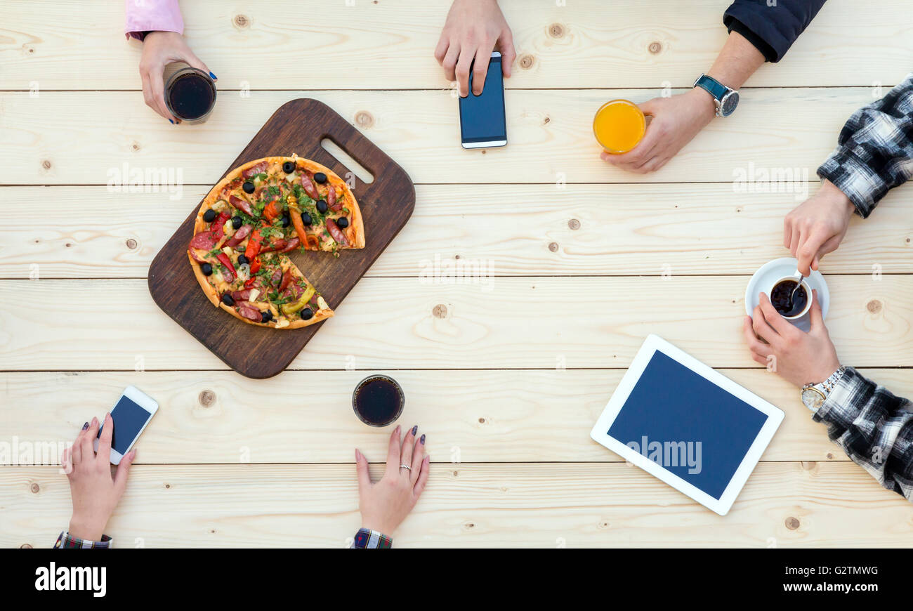 Company of Friends at Cafe Pizza Table Stock Photo - Alamy