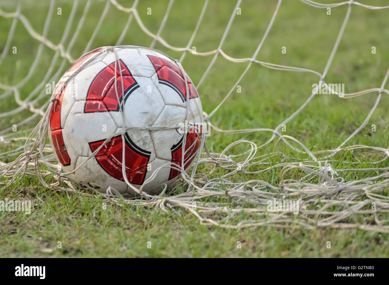 Soccer ball in a empty goal Stock Photo - Alamy