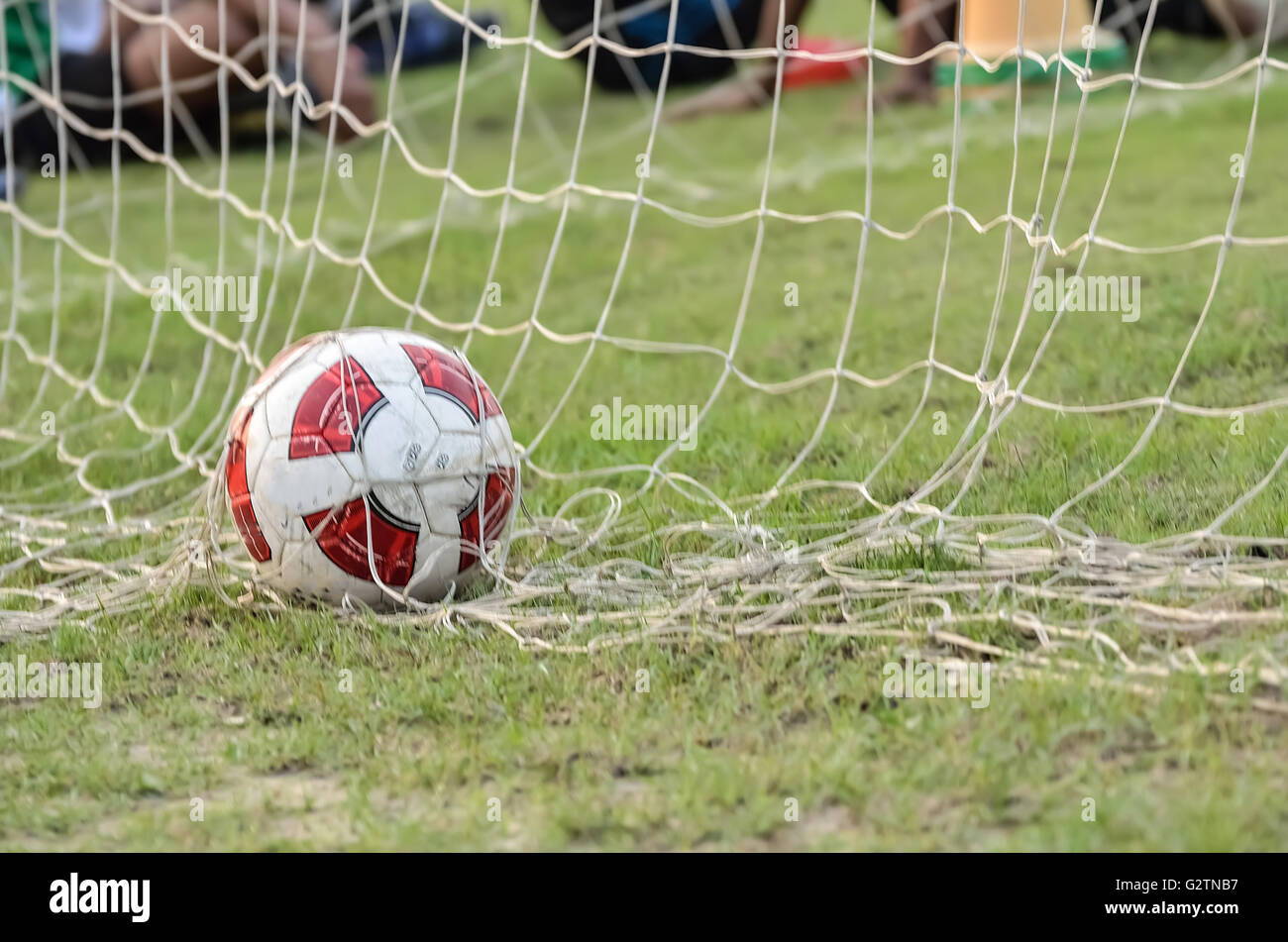Soccer ball in a empty goal Stock Photo - Alamy