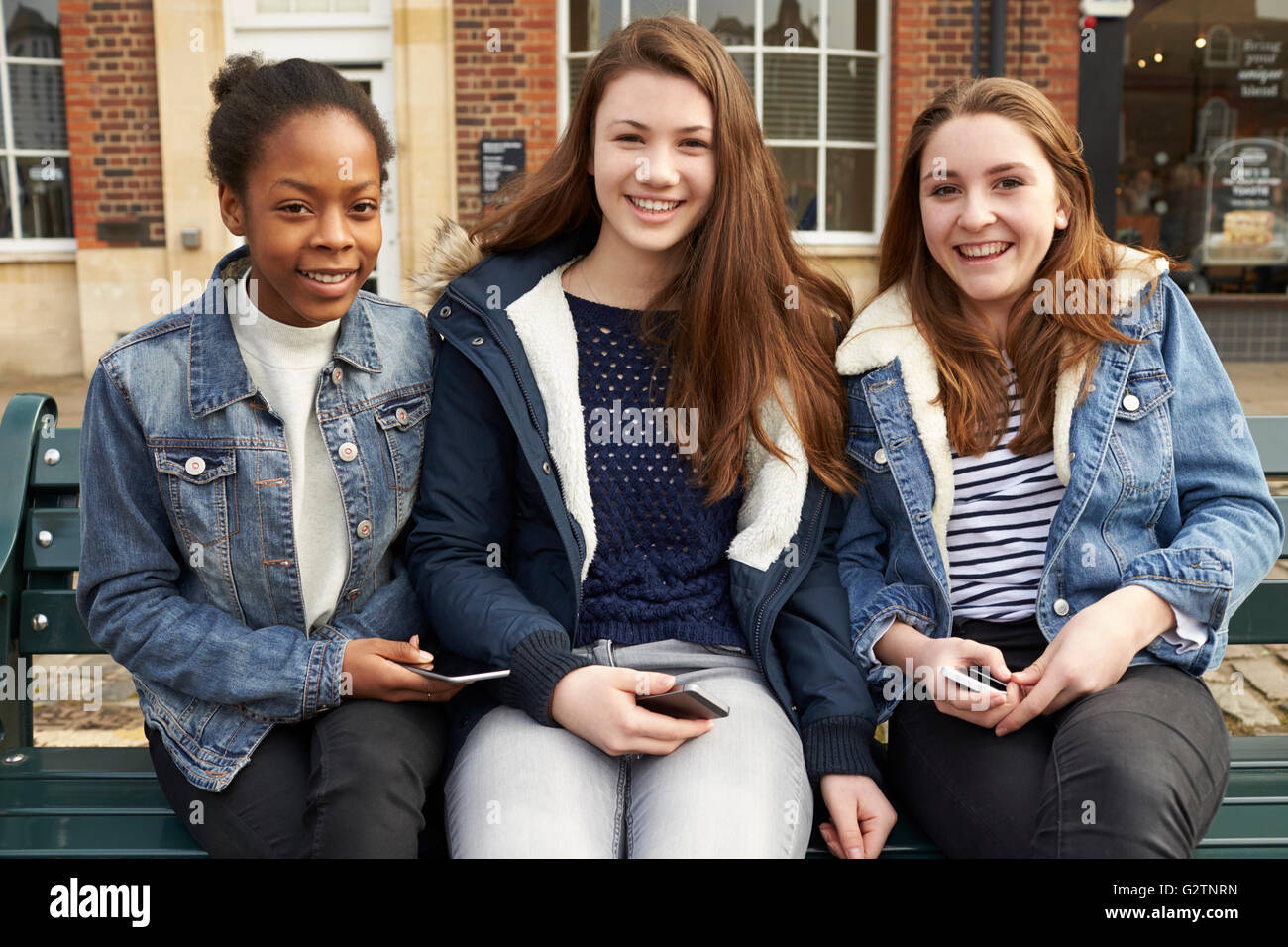 Portrait Of Teenage Girls Hanging Out In City Centre Stock Photo - Alamy