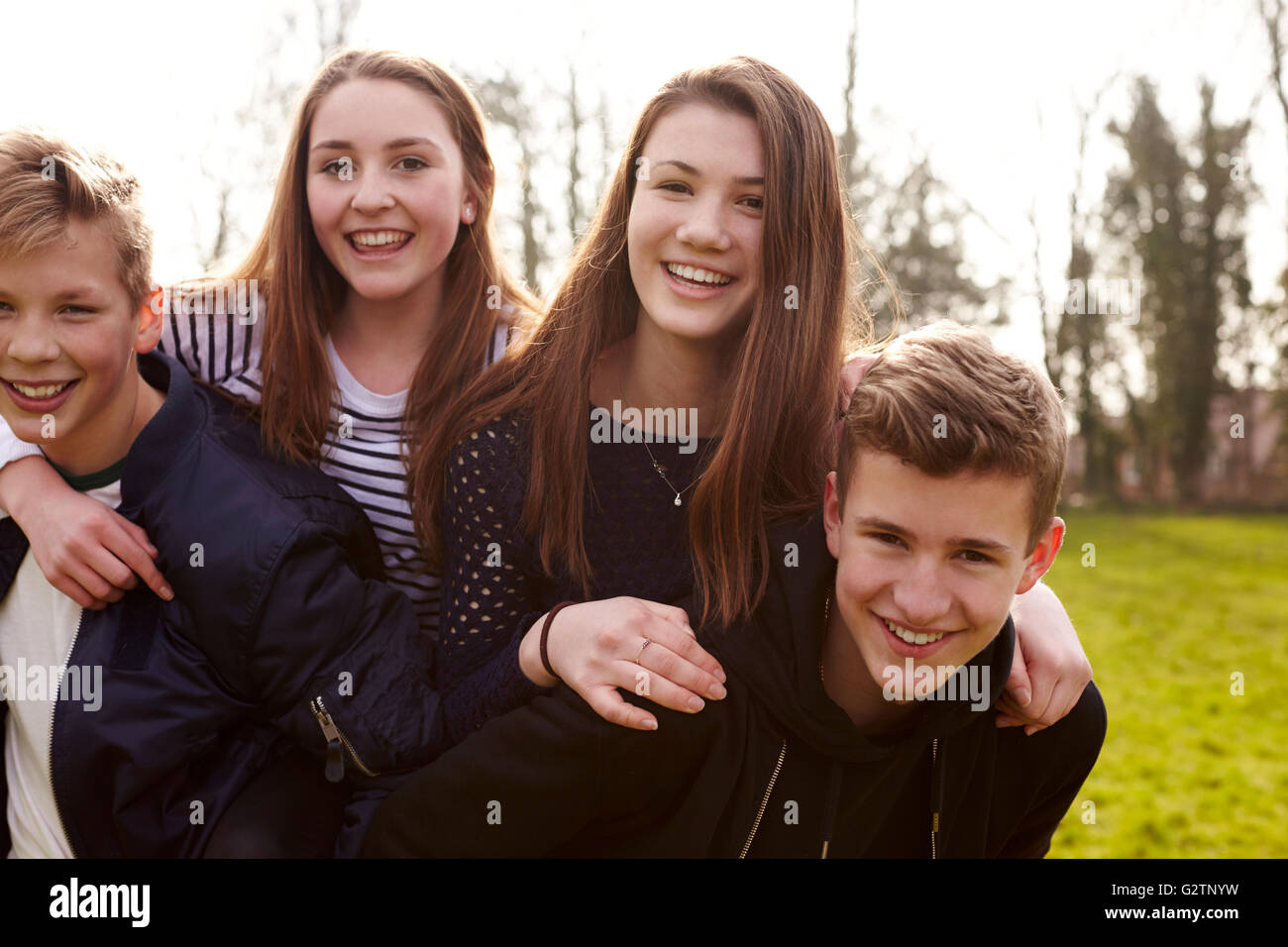 Portrait Of Teenage Friends Hanging Out In Park Together Stock Photo ...