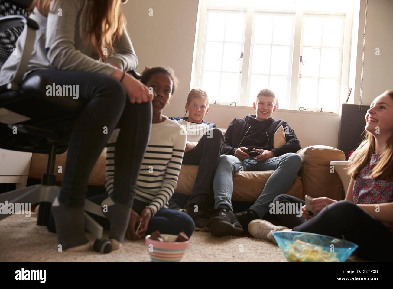 Group Of Teenagers Playing Video Game In Bedroom Stock Photo - Alamy