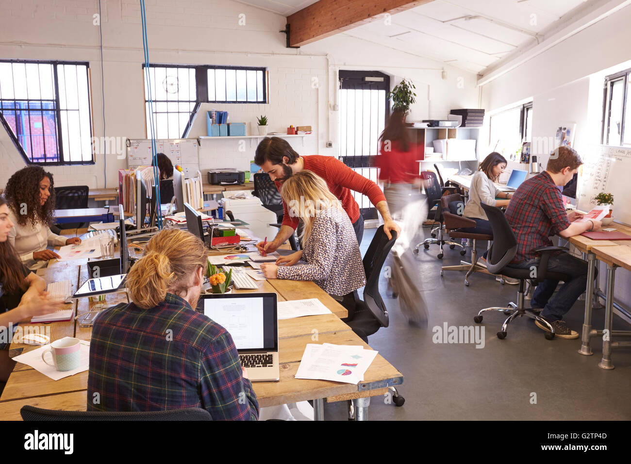 Interior Of Busy Design Office With Staff Stock Photo - Alamy
