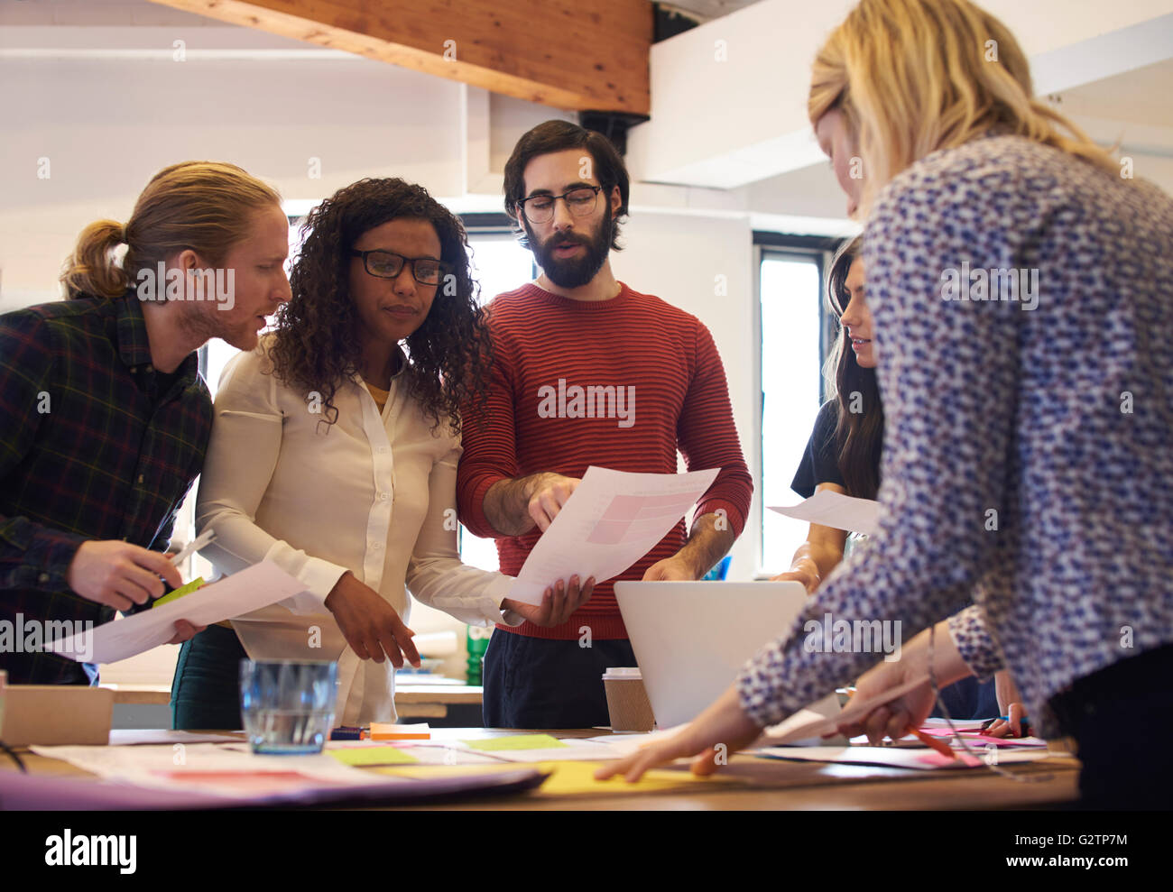 Team of designers having a meeting in creative office Stock Photo - Alamy