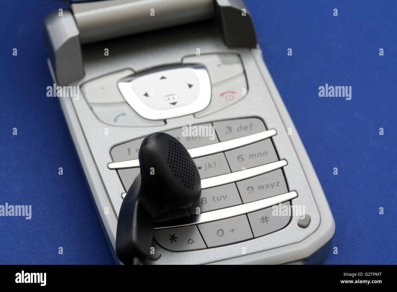 Cell phone with hands free Stock Photo - Alamy