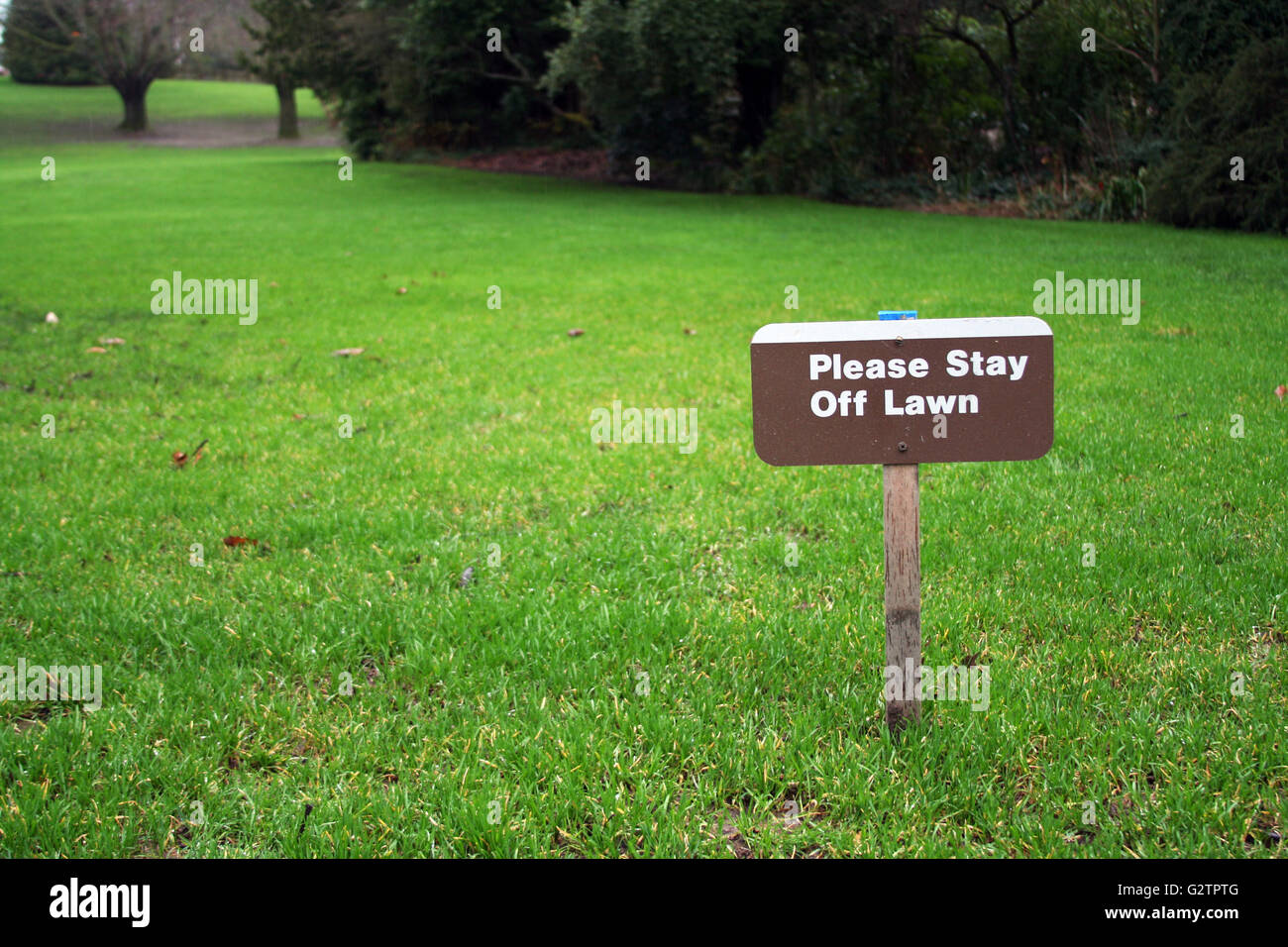 A sign on a grass field Stock Photo - Alamy
