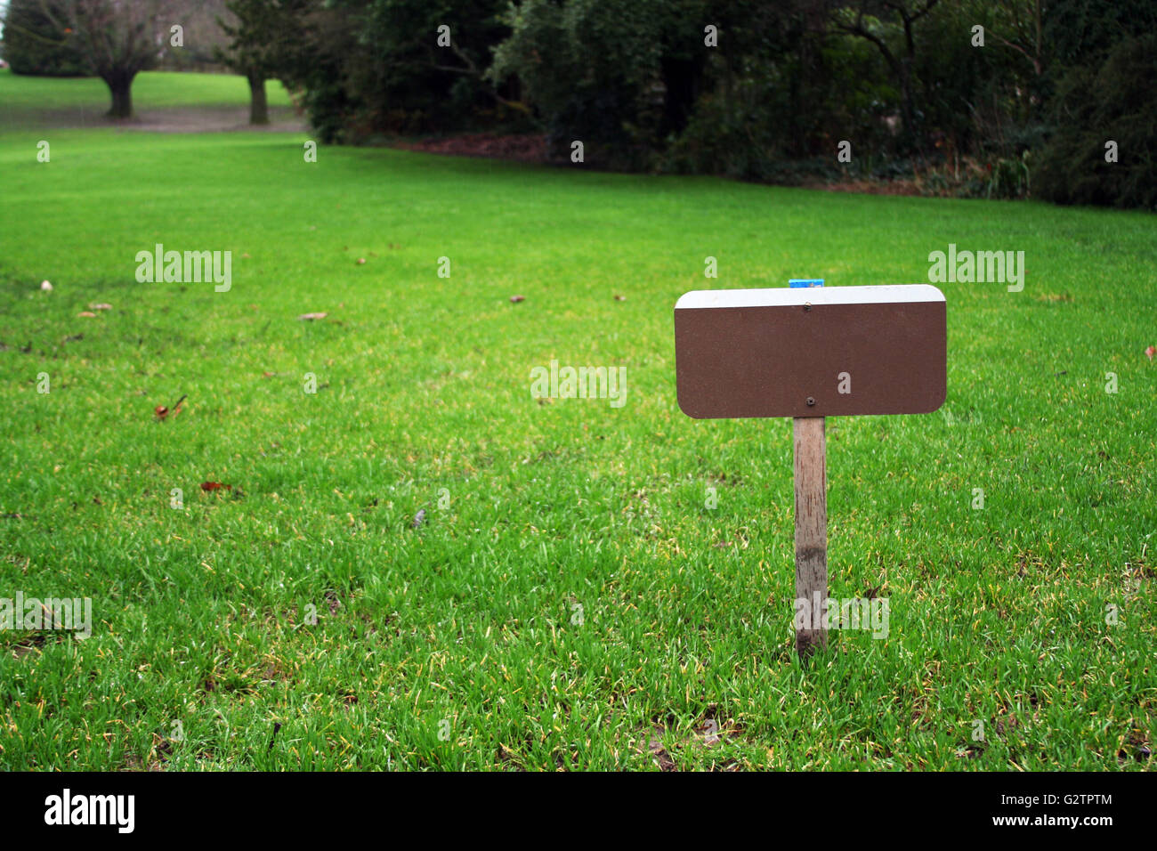 A sign on a grass field Stock Photo - Alamy