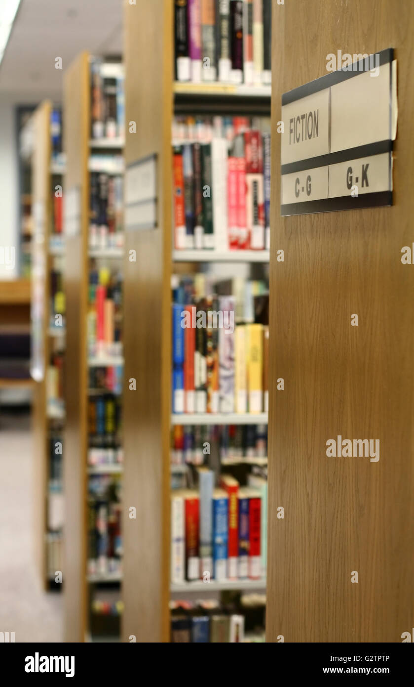 Bookshelves in library Stock Photo - Alamy