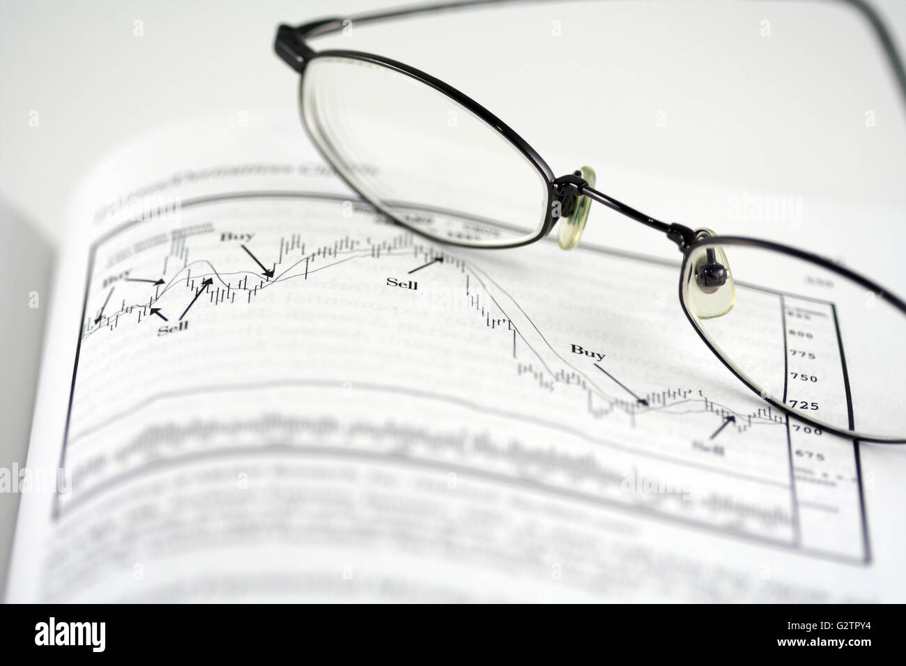 Stock analysis with chart and glasses Stock Photo - Alamy