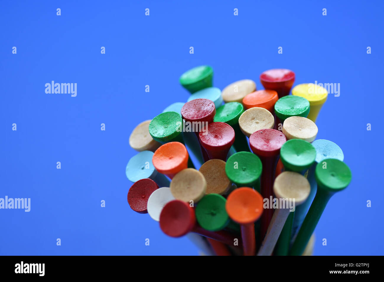 Bunch of colorful wooden golf tees Stock Photo - Alamy
