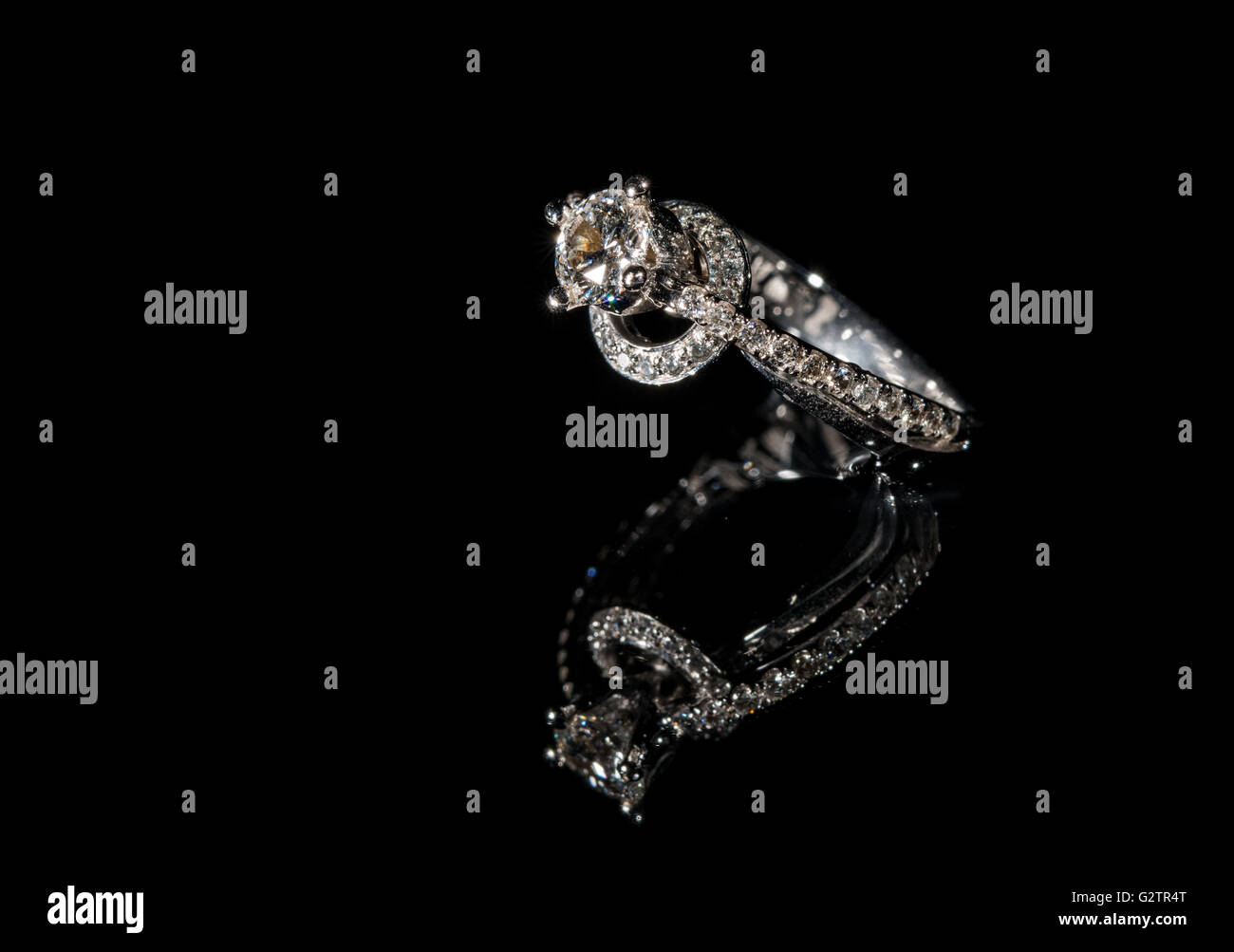 Diamond Engagement Ring on black background, reflection Stock Photo - Alamy