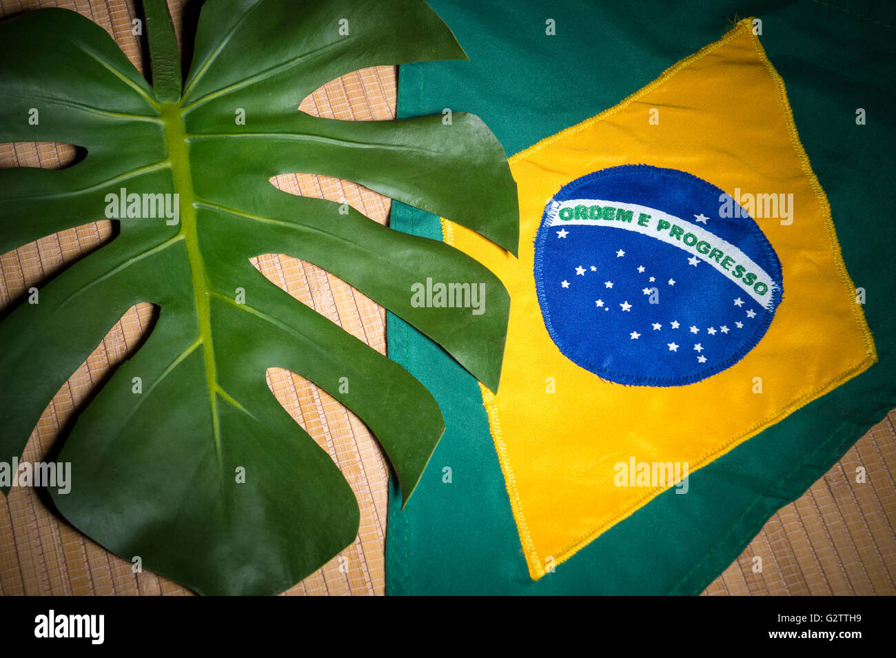 Brazil pennant flag tropical leaves on rustic natural fibre rattan ...