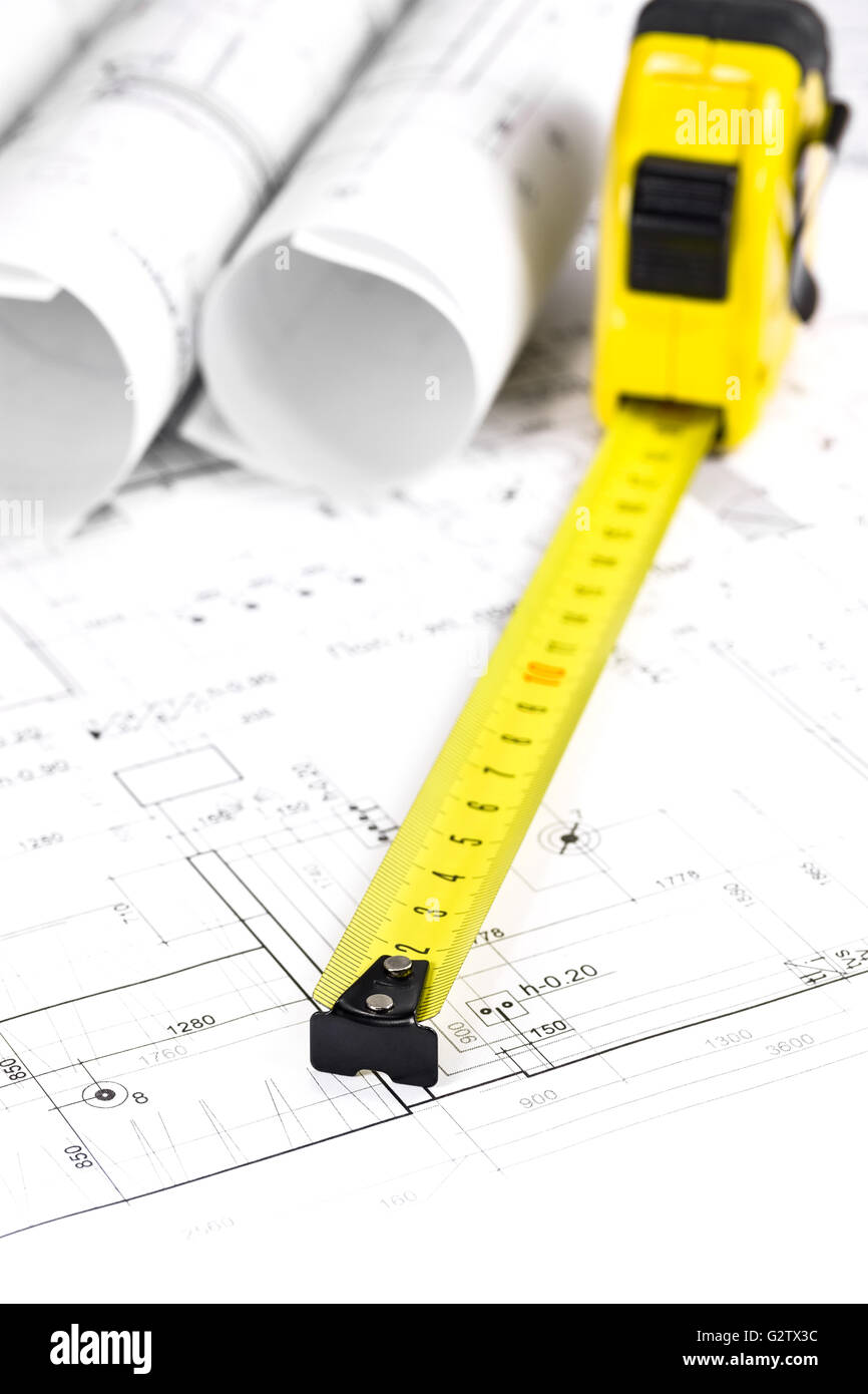 Home blueprint plans and yellow measuring tape Stock Photo - Alamy