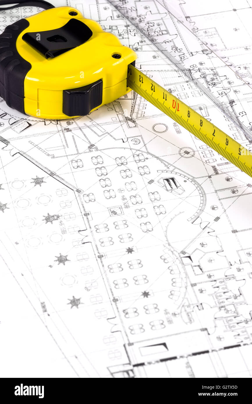 Home building construction plans with yellow measuring tape Stock Photo ...