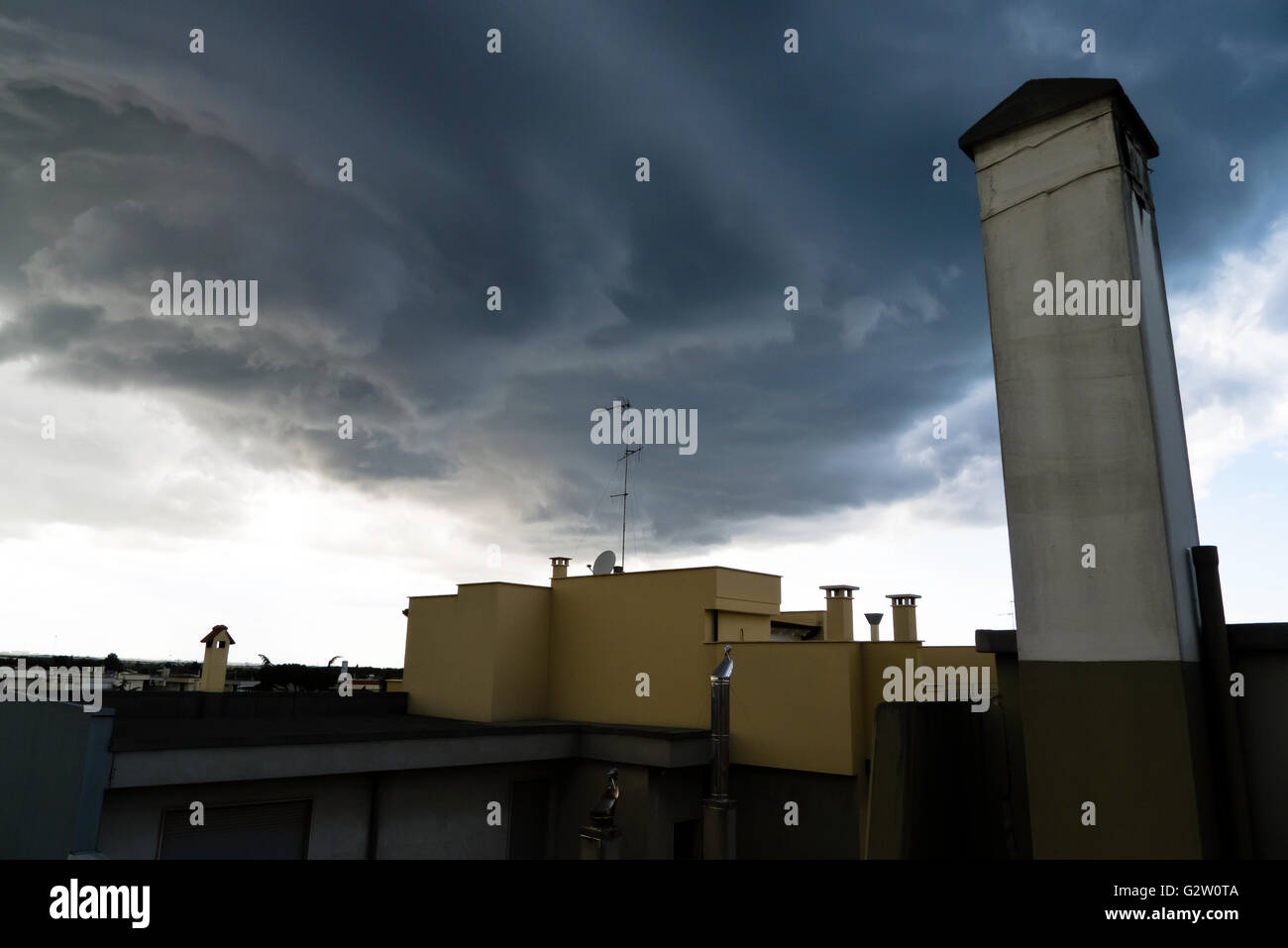 Clouds on buildings Stock Photo - Alamy