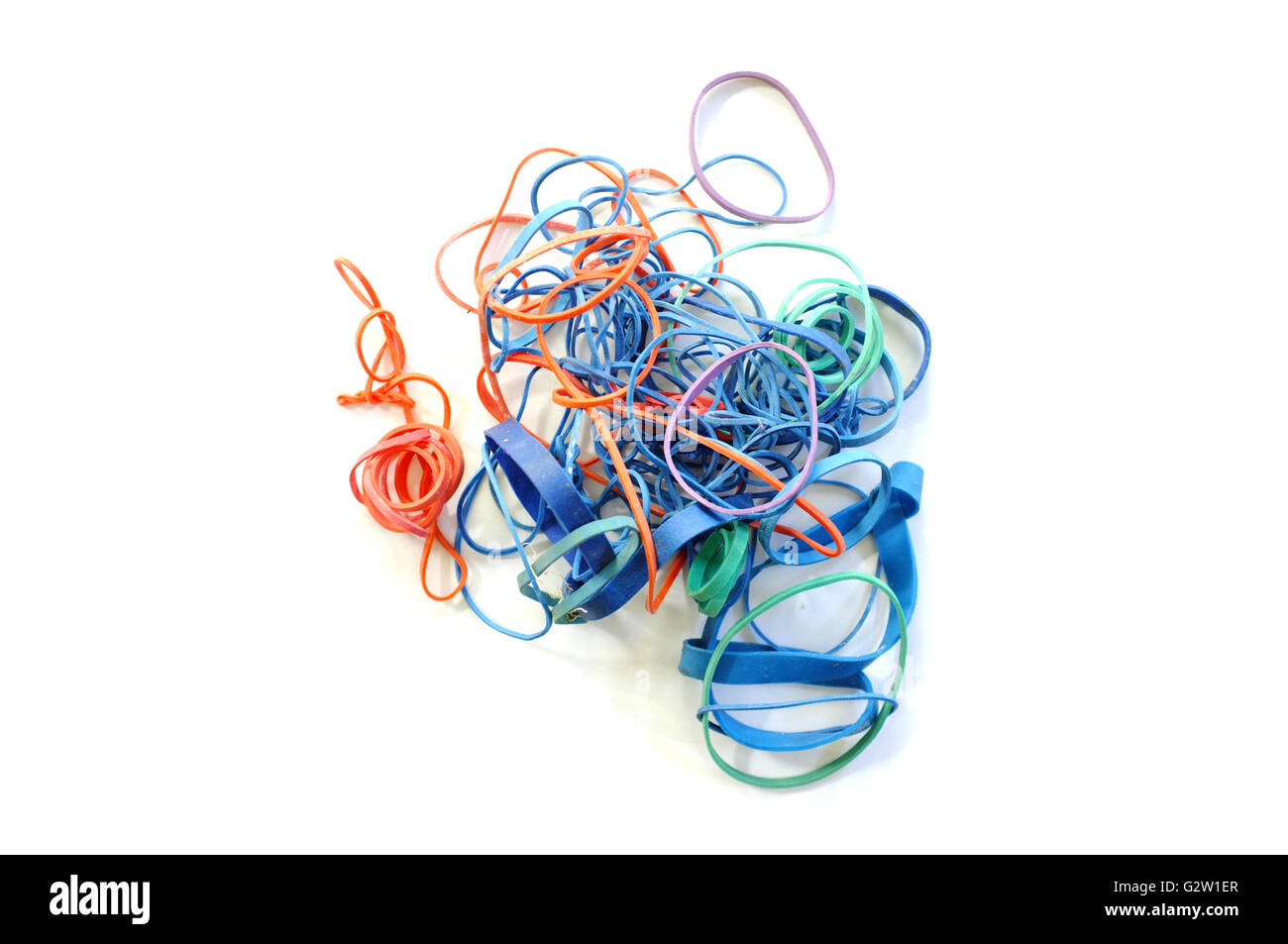 A pile of red, blue and green elastic bands photographed against a ...