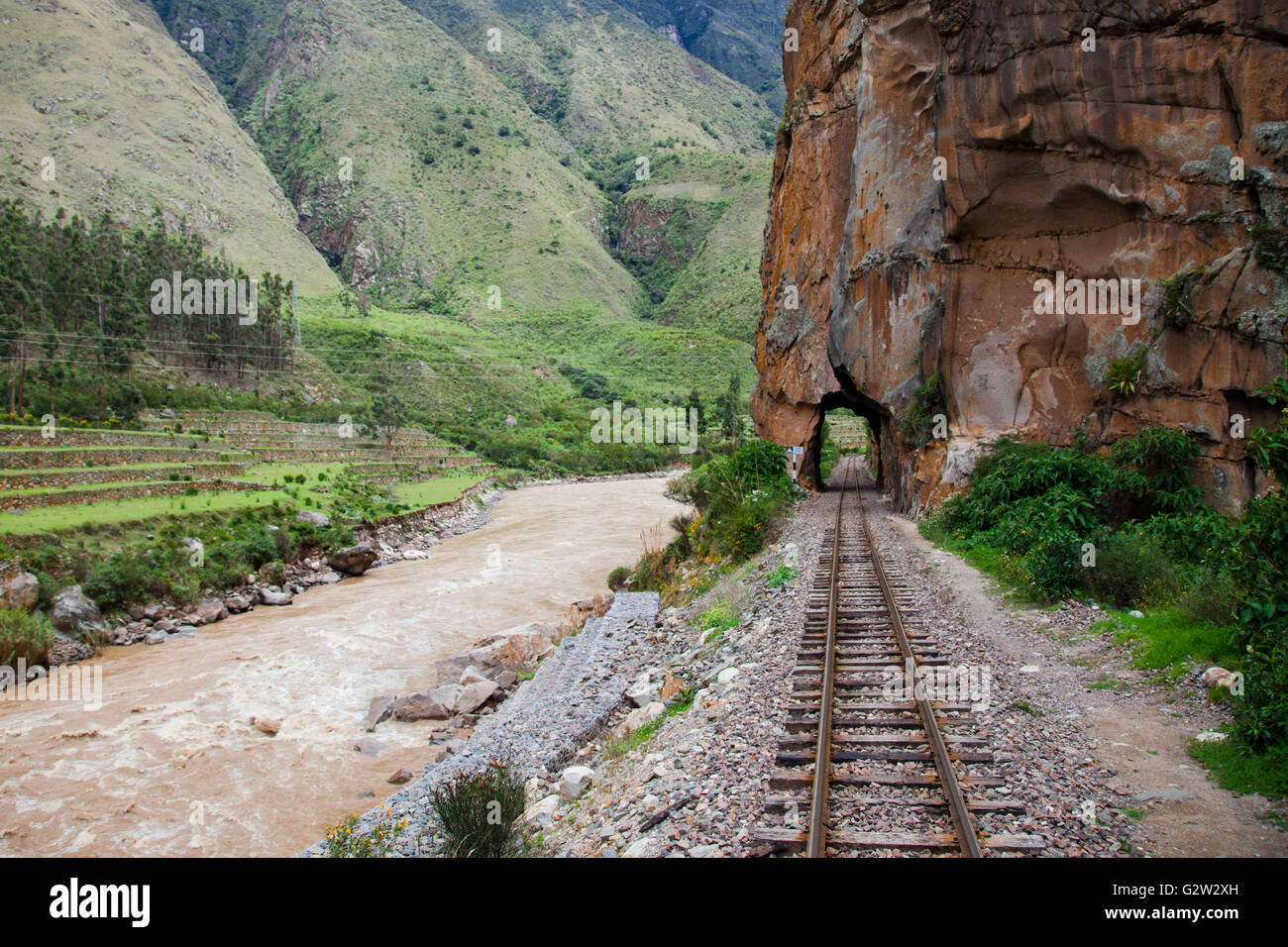 Train tracks through mountain tunnel in Peru Stock Photo - Alamy