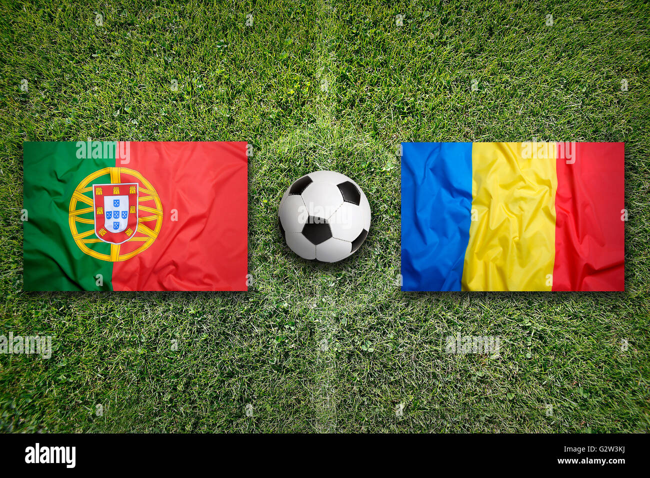 Portugal vs. Romania flags on a green soccer field Stock Photo - Alamy
