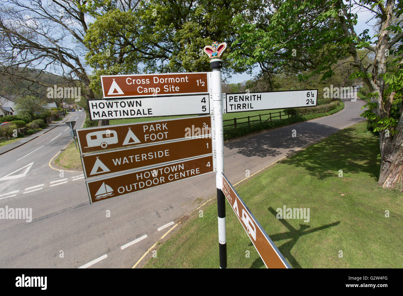 Pooley Bridge, England. Picturesque view of a fingerpost road sign with ...