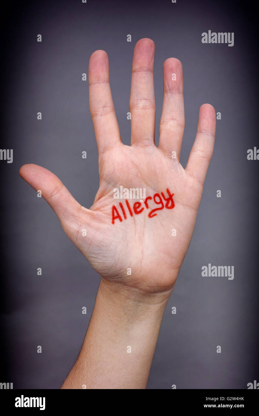 Hand with writting Allergy. Close up Stock Photo - Alamy
