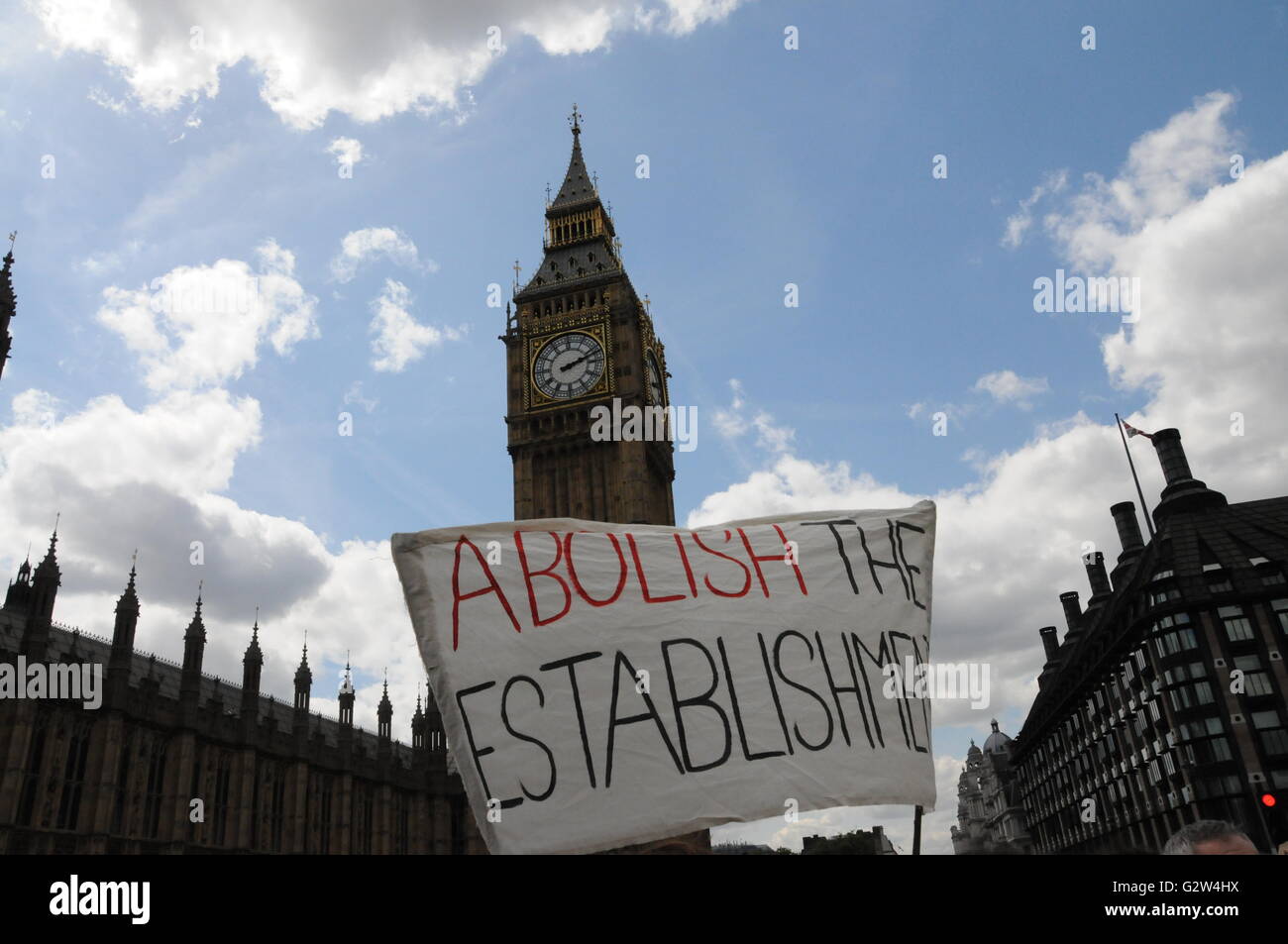 Anti-establishment placard held in front of Big Ben Stock Photo - Alamy