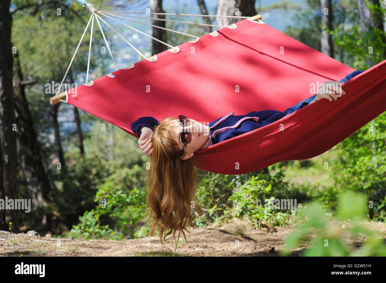 Happy Girl Relaxing In Hammock Stock Photo - Alamy