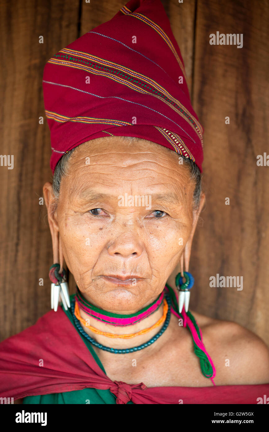 Portrait of a mature Kayah woman with traditional headscarf and ...