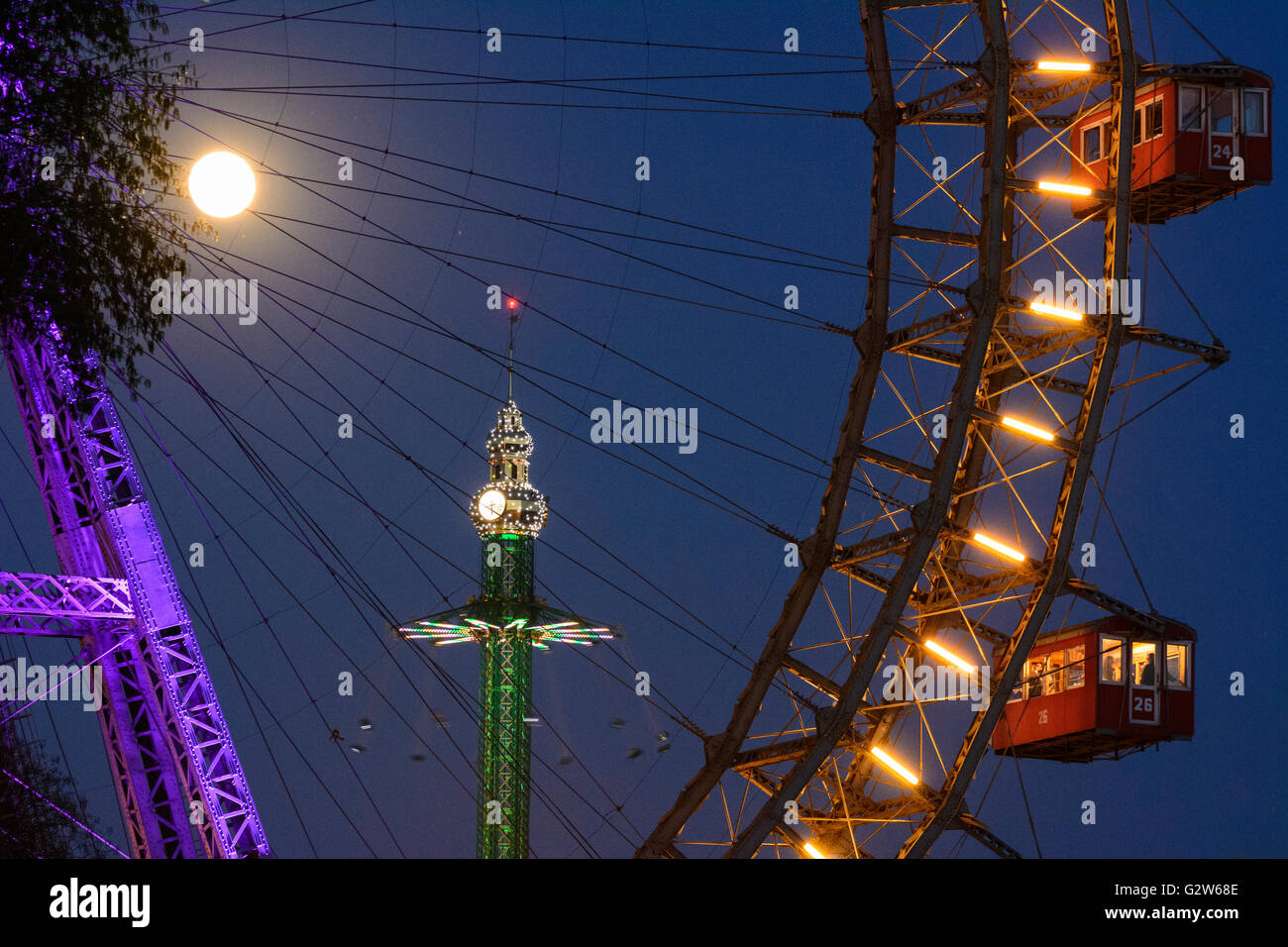 Ferris Wheel and Carousel Swings " Praterturm " in the Prater at full ...