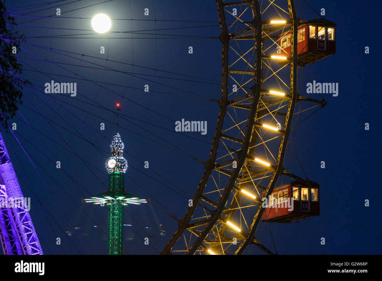 Ferris Wheel and Carousel Swings " Praterturm " in the Prater at full ...