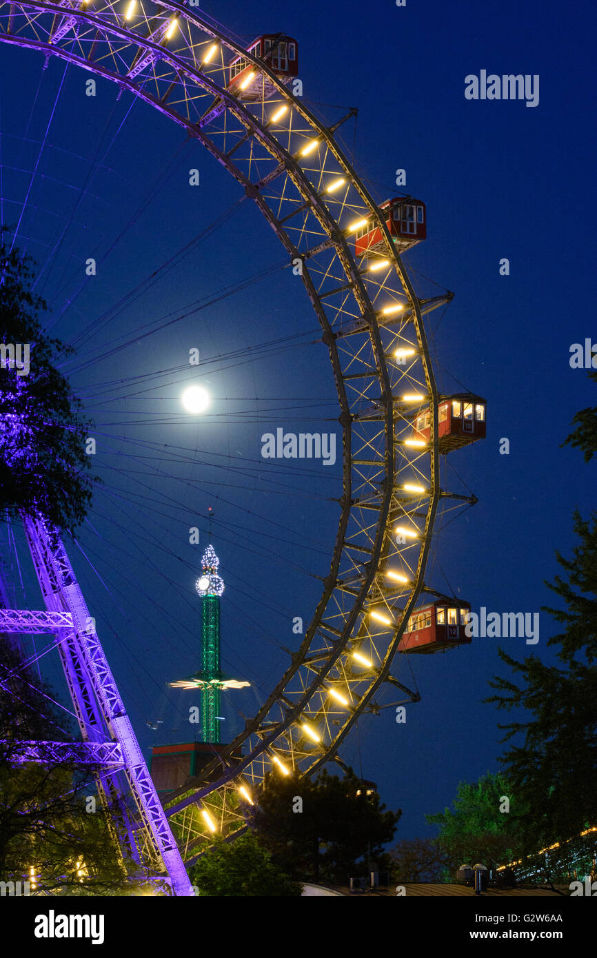 Ferris Wheel and Carousel Swings " Praterturm " in the Prater at full ...
