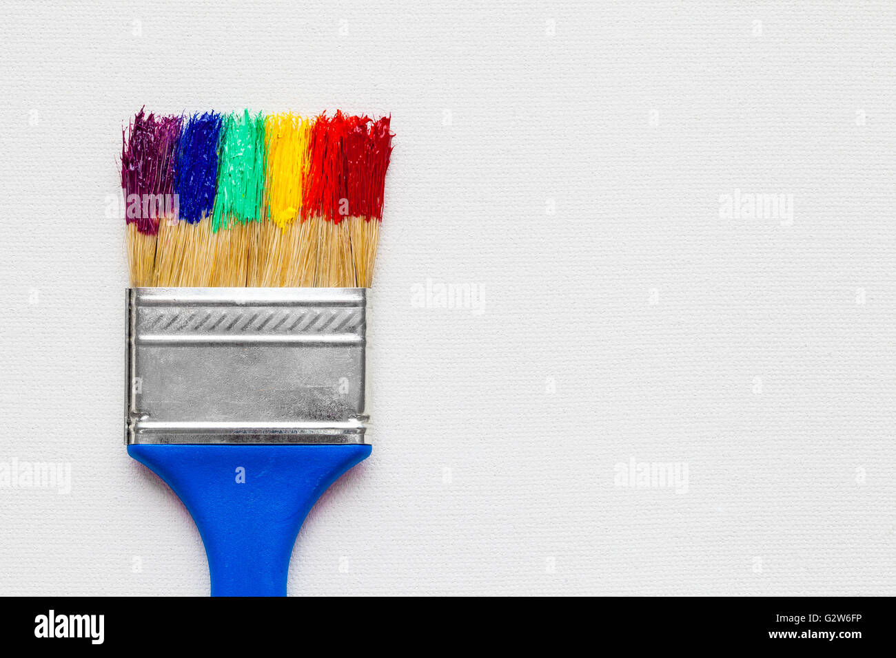 Paintbrush with paint on white artist canvas Stock Photo - Alamy