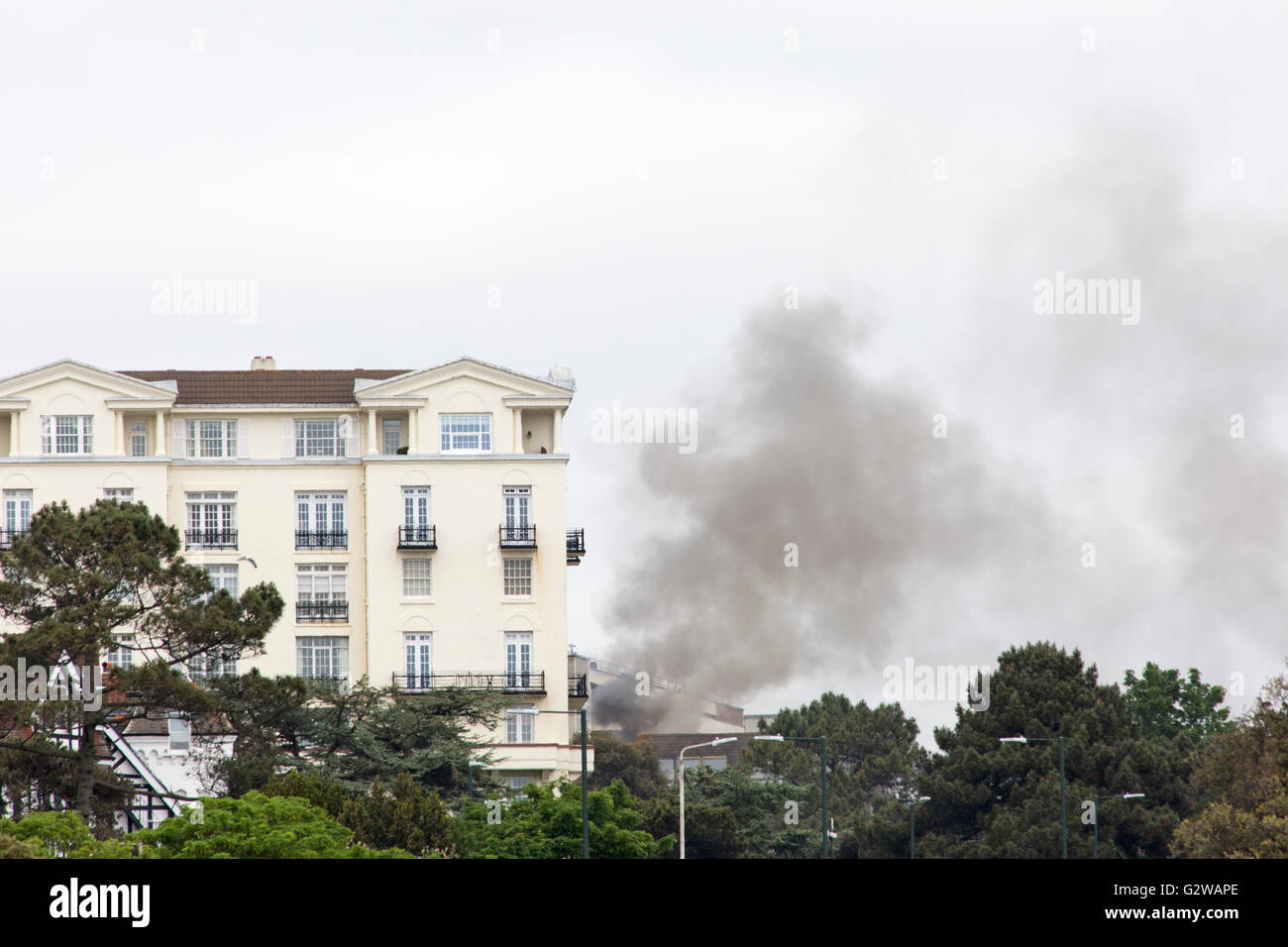 Bournemouth, Dorset UK 3 June 2016. Fire crews putting out fire at old ...