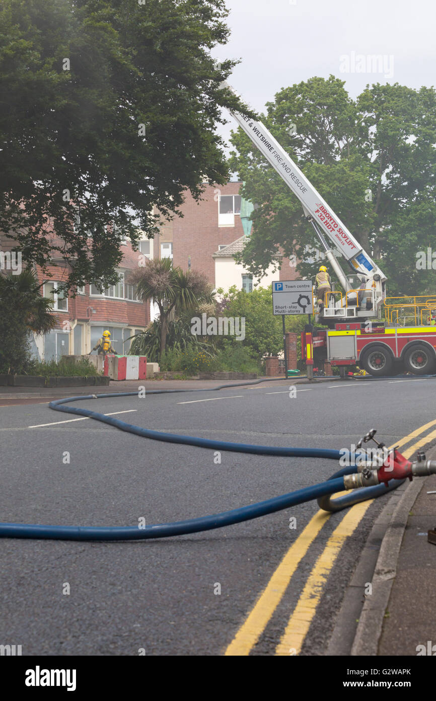Bournemouth, Dorset UK 3 June 2016. Fire crews putting out fire at old ...