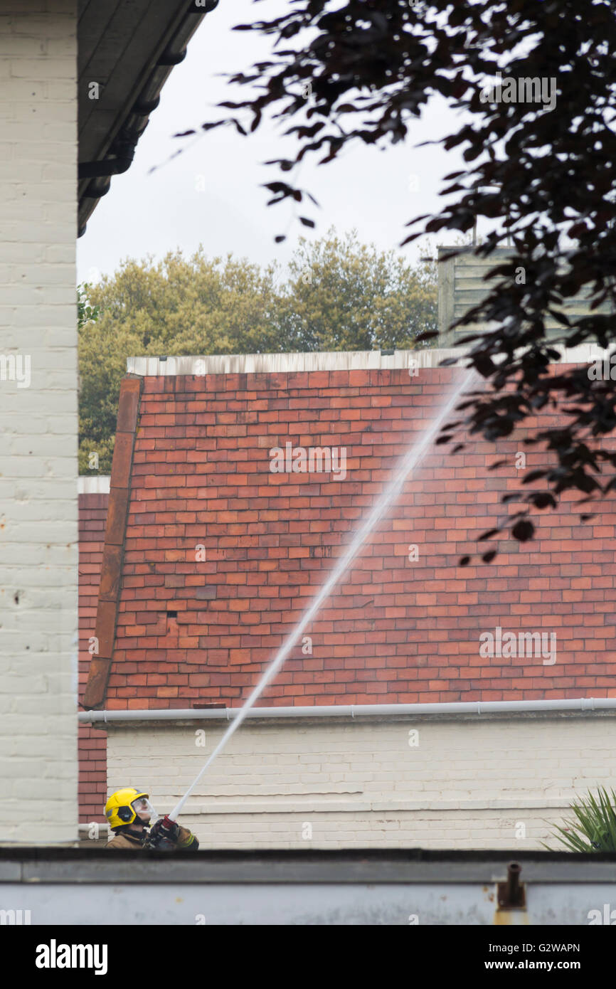 Bournemouth, Dorset UK 3 June 2016. Fire crews putting out fire at old ...